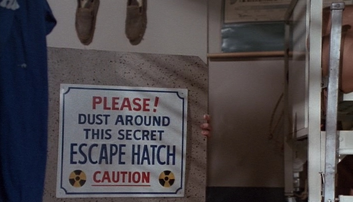 ceMental: A Team Stills Funny Escape Hatch Sign on Floor