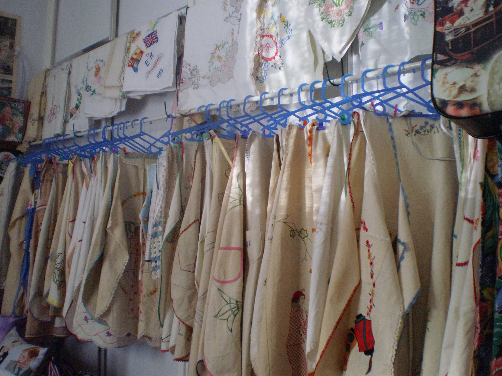 Linens and Royals: Vintage Embroidered Aprons on Display