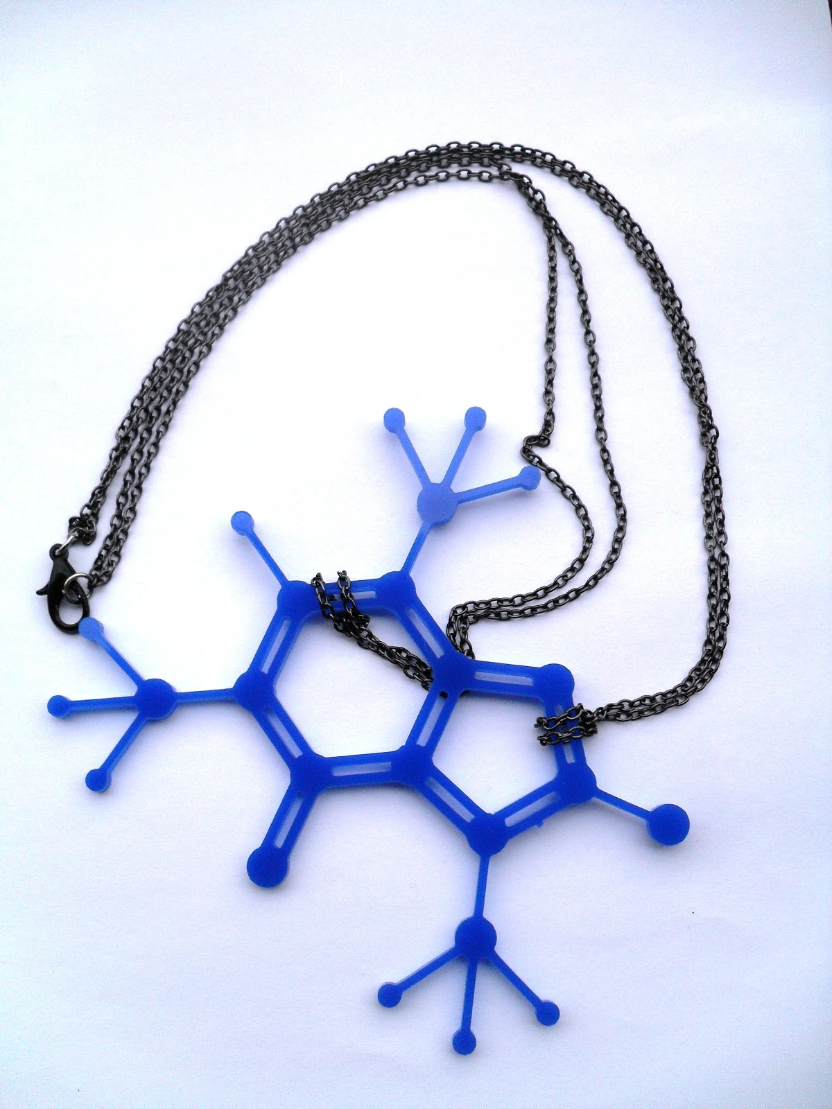 CRAFTWOMEN Studio: C8H10N4O2 Necklace in Blue