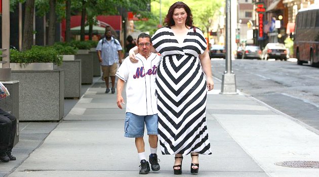 Giant Amazon Model Dwarfs Men For A Living