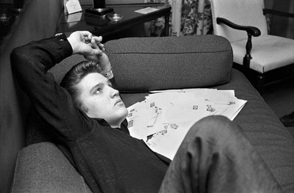 Elvis Presley Reading Fan Mail in His Suite at the Warwick Hotel in New ...
