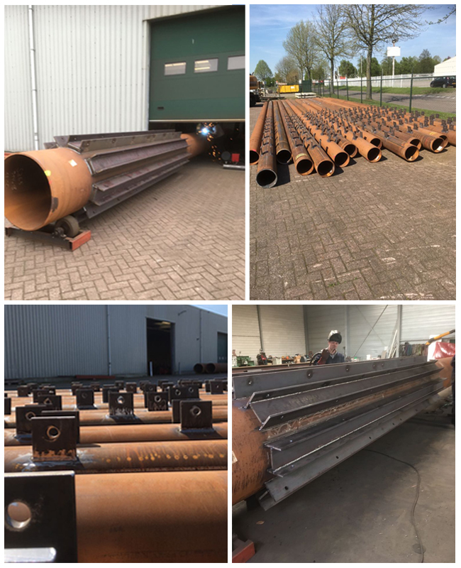 Stalen buizen voor een drijvende steiger in de haven van Scheveningen.