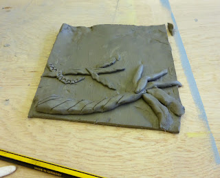 Paper Hat Parties: Clay relief sculptures