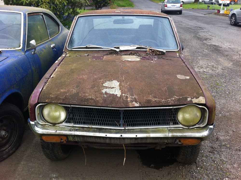 OLD PARKED CARS.: Mossy Mazda #2: Badgeless 1971 Mazda R100 Coupe.
