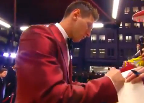 Lionel Messi wears bright red suit to Ballon D'Or (Video) ~ Holdout Sports
