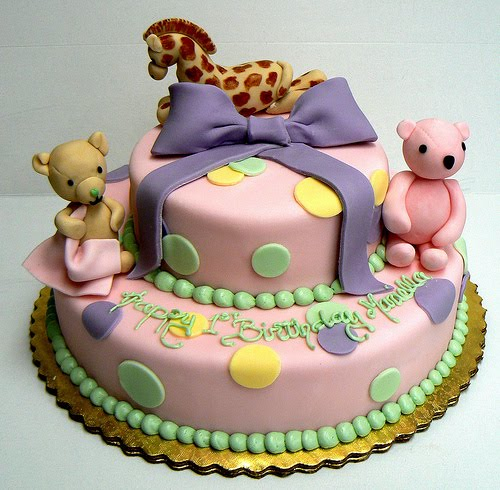 OohLaLa cakes: Pink-frosted cake with animal decorations