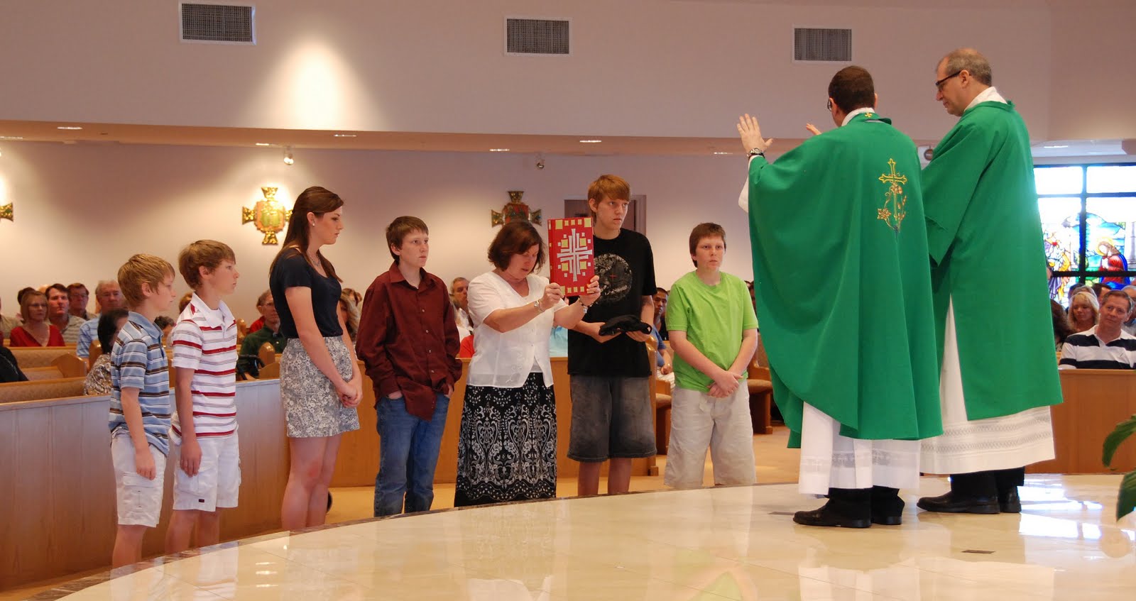 Saint Raphael Messenger: Catechumens receive a blessing