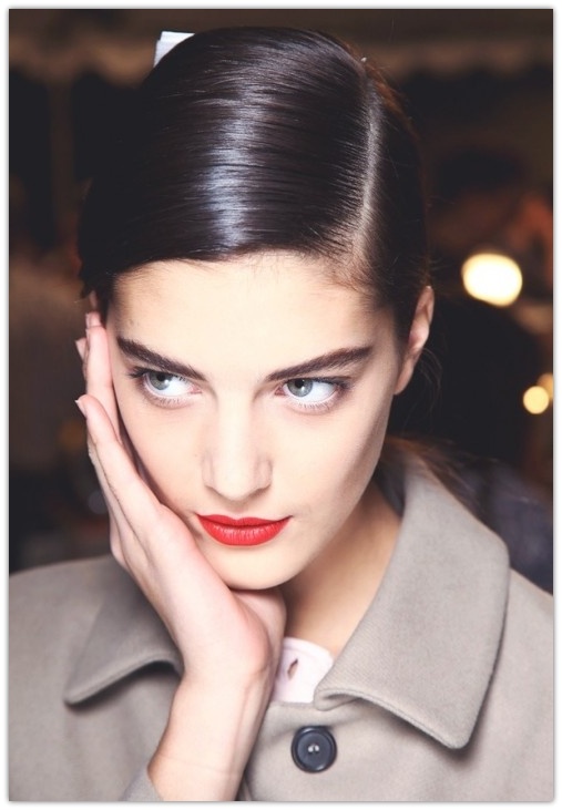 Deep side parted hair