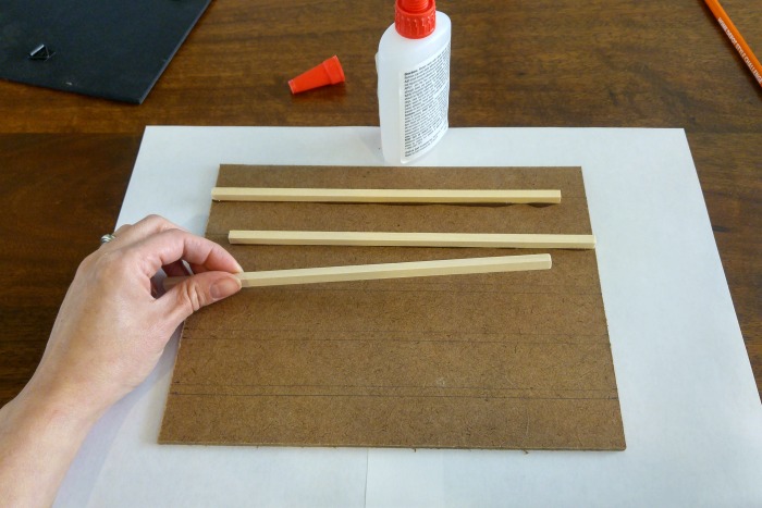 7. Next, add the vertical stiles tightly against the rails.