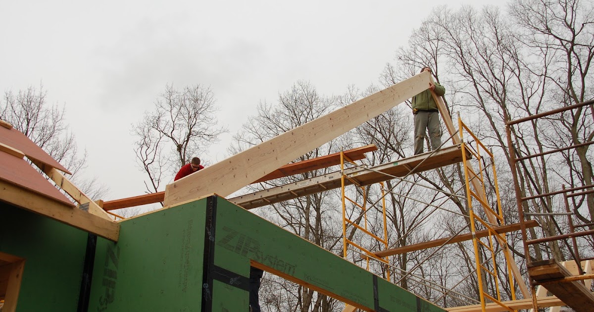 Home Under Construction: Setting the First Ridge Beam