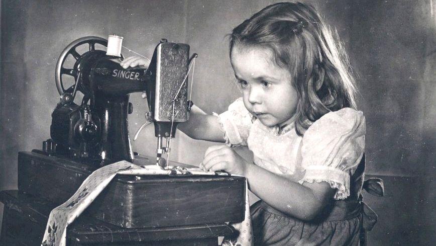 Girl At Sewing Machine