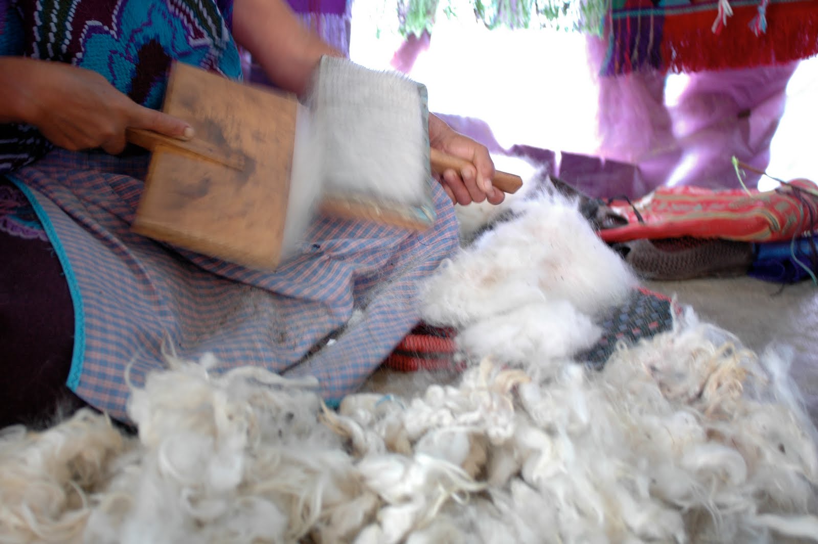 Artists Helping Artisans: Preparing wool stage 2 - brushing and spinning