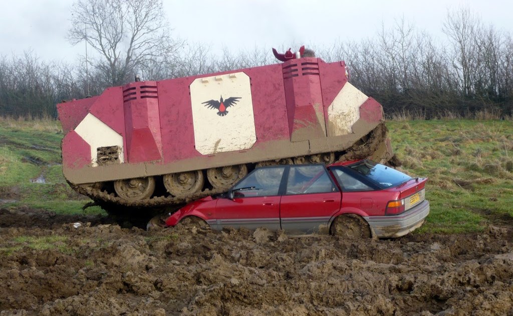 Super Punch: Video of a real life Warhammer 40K Rhino rolling over cars