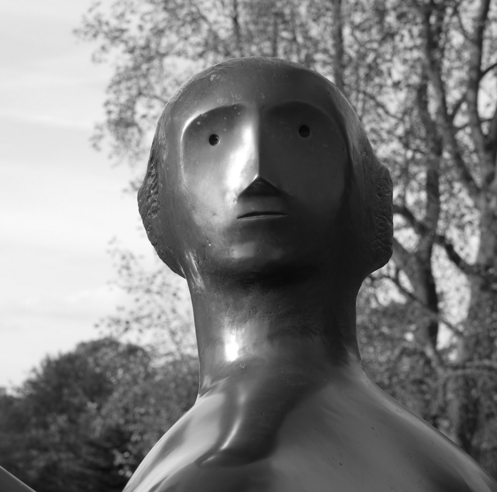 AURA OF PAST SHADOWS: STYLISED HEAD - HENRY MOORE.