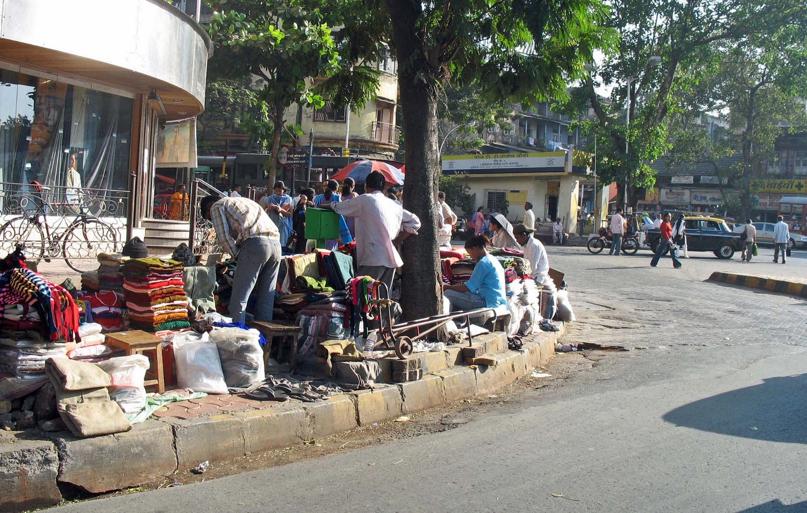 Stock Pictures: Road side vendors in India blocking the pavements