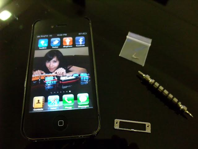 Using the attached screwdriver to remove the original screw.