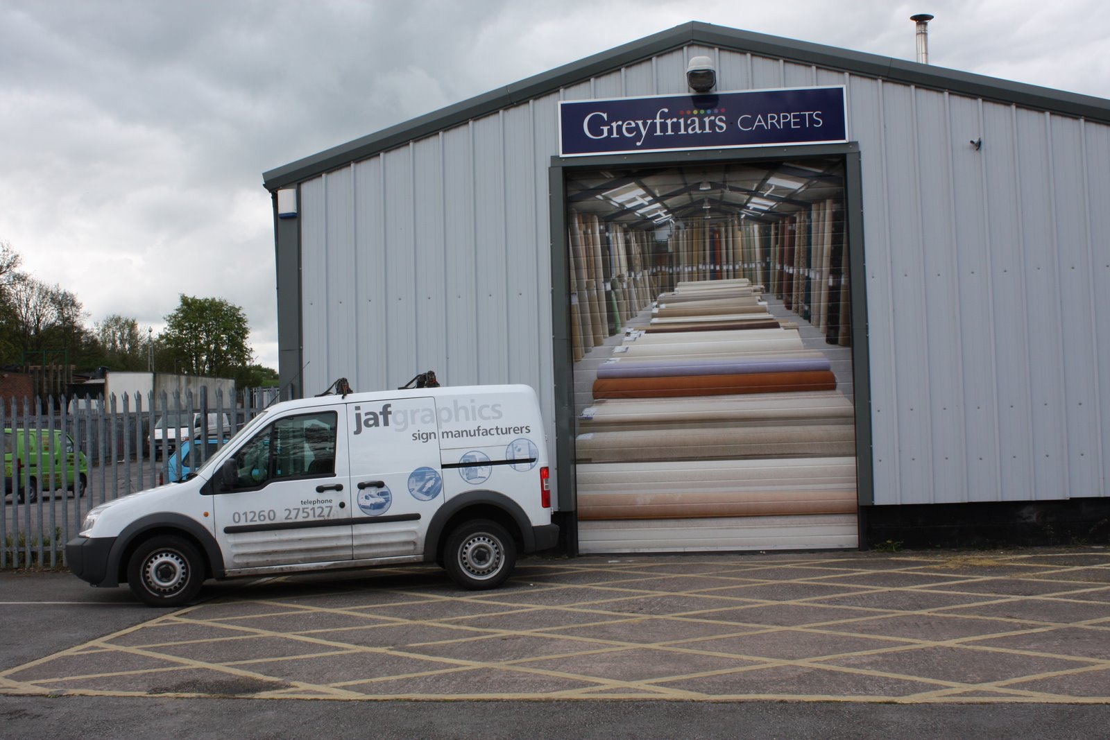 A Sign Makers Blog: Vinyl Wrapping a Roller Shutter Door