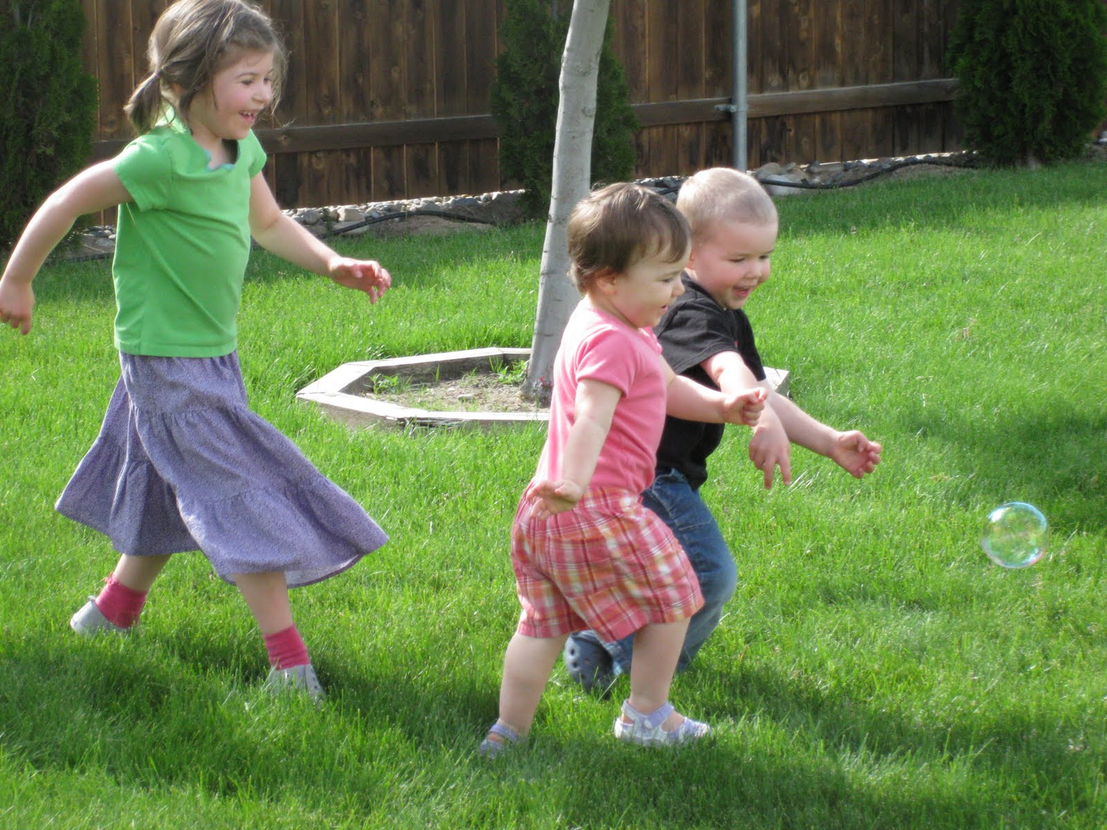 The Adventures of Bad Guy Danger: Happy children chasing bubbles