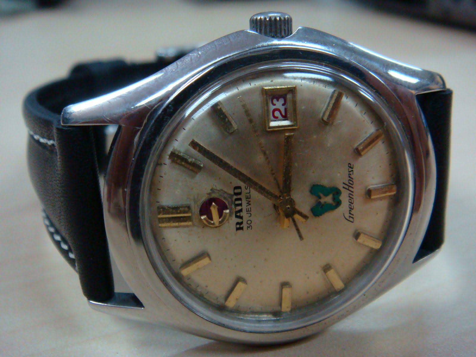 kunci jam: Rado Green Horse