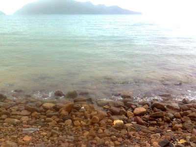 FOTOS CON Y SIN ROLLO: Playa Conoma un día lluvioso