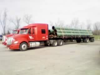 The Day and Life of a Flatbed Trucker: Load of Pipe running to Texas