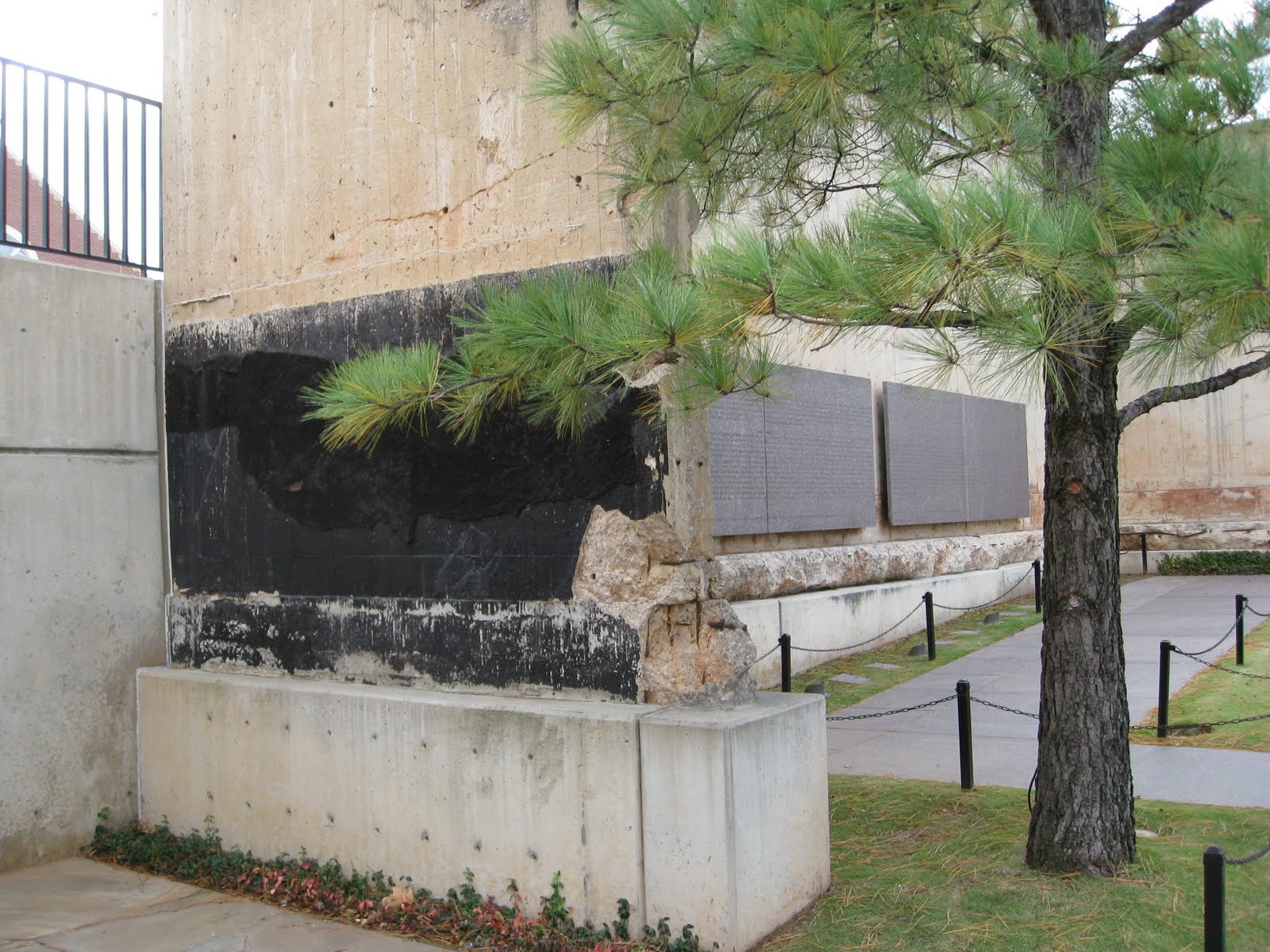 Top-of-the-Arch: OUTDOOR SYMBOLIC MEMORIAL - THE FENCE AND SURVIVOR WALL