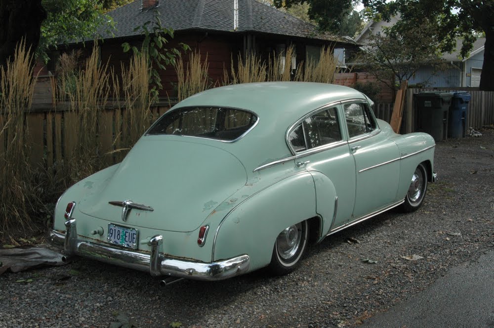 OLD PARKED CARS.: 1950 Chevrolet Deluxe Fastback.