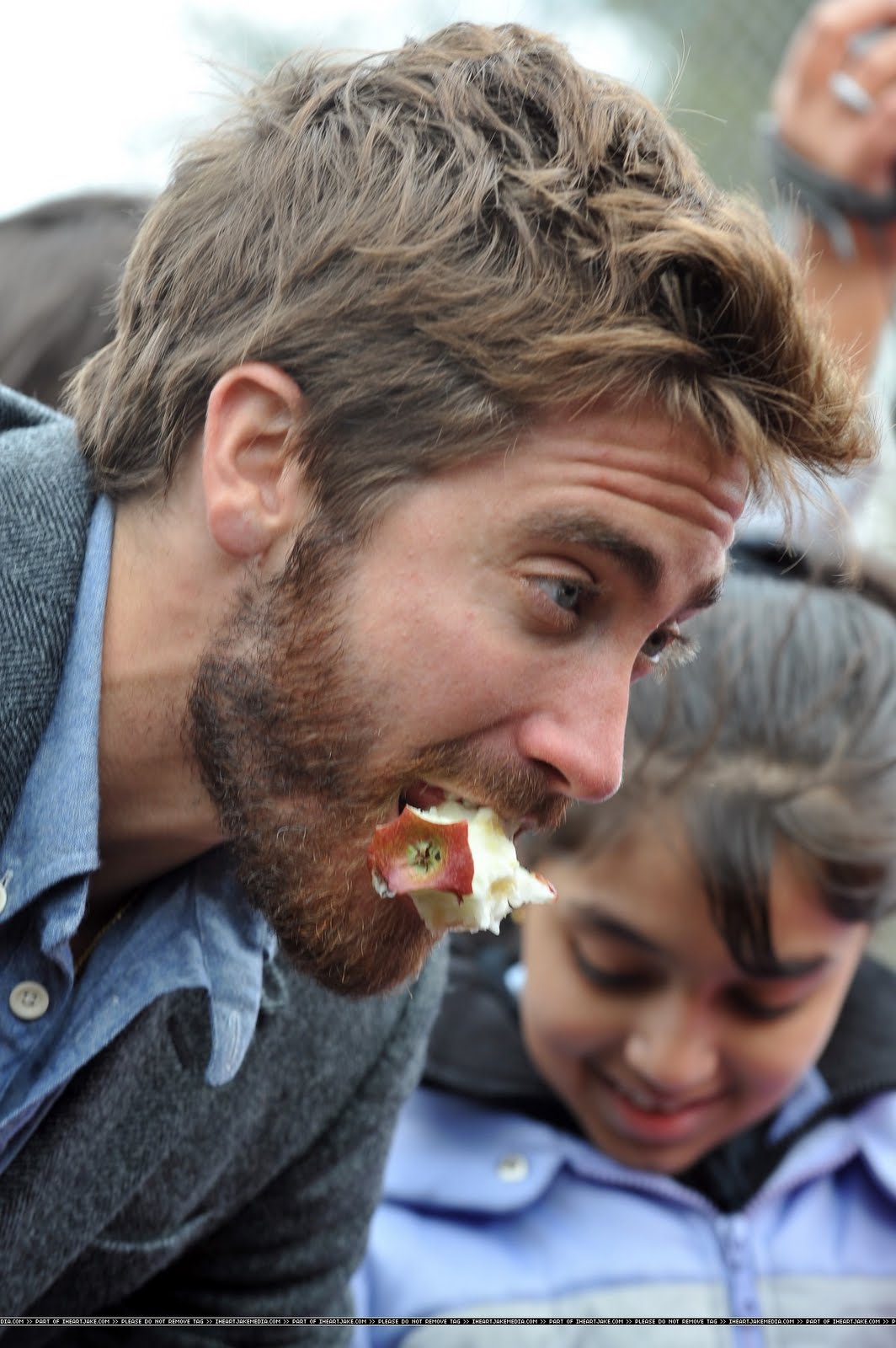 WEIRDLAND: Jake Gyllenhaal eating an apple at the Opening of First Edible Schoolyard