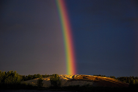 Guy photographs end of the rainbow