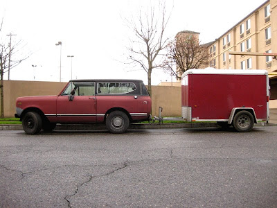 OLD PARKED CARS.: 1977 International Harvester Scout w/Trailer.