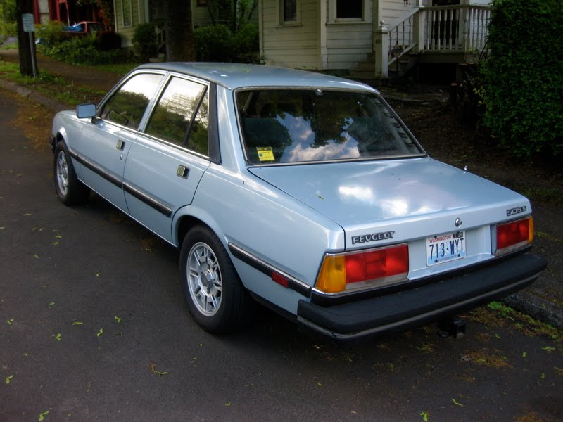 OLD PARKED CARS.: 1988 Peugeot 505 S Sedan.