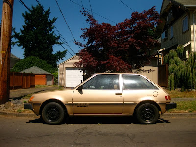 OLD PARKED CARS.: 1980 Dodge Colt Hatchback.