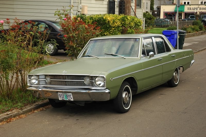 OLD PARKED CARS.: 1968 Dodge Dart Sedan.