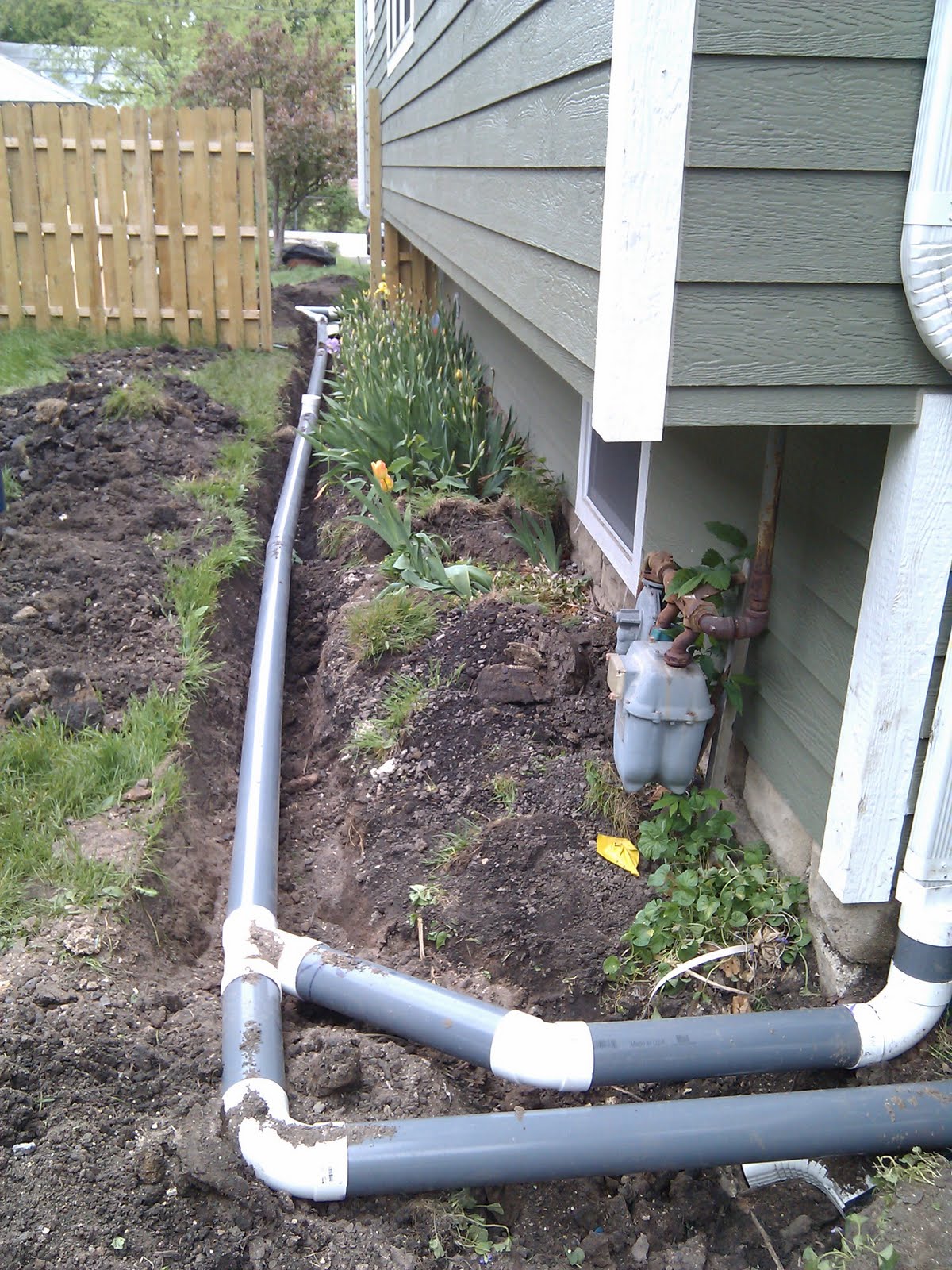 Solving our Basement Water Problem by Burying our Downspouts