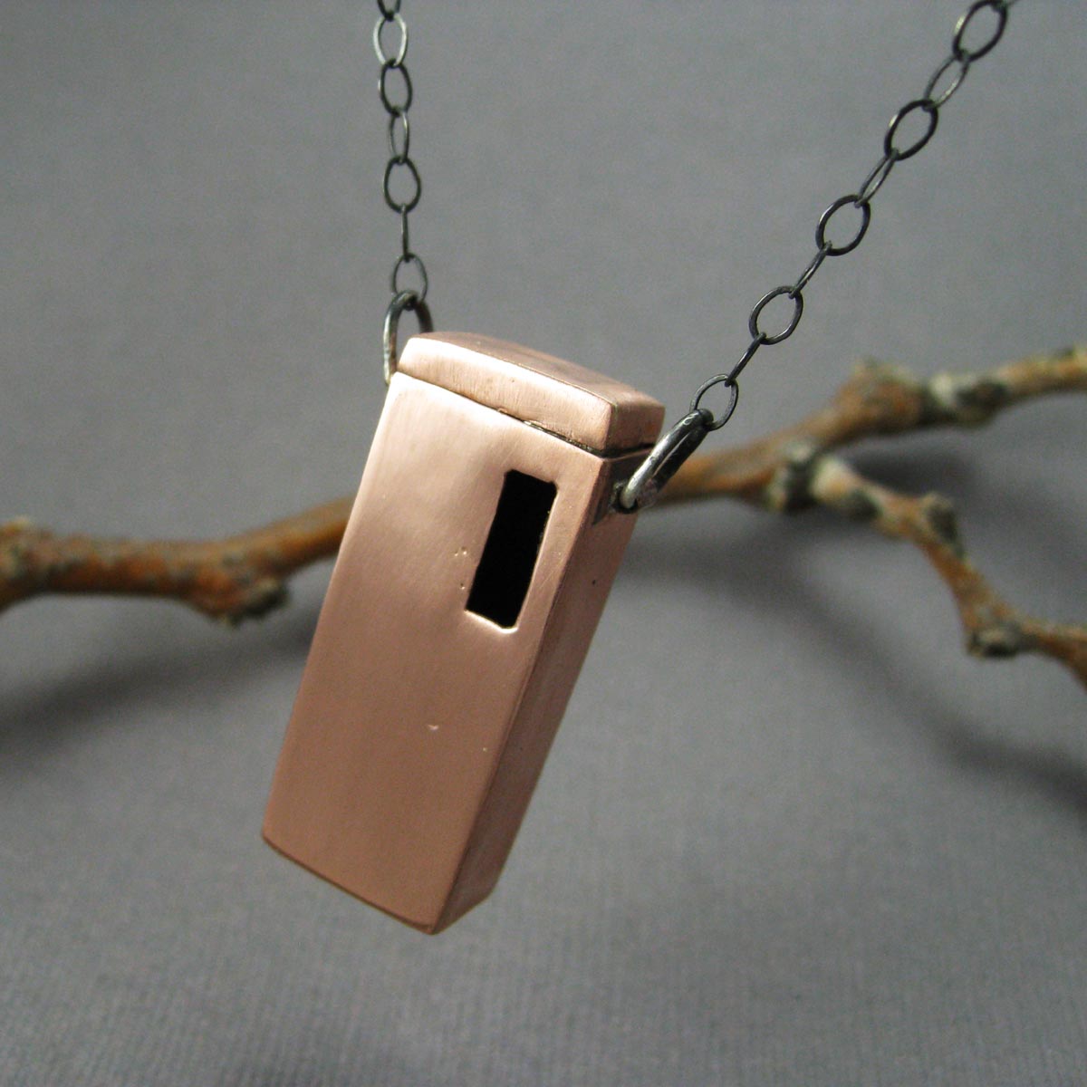 from the edge of the prairie . . .: Copper box pendant