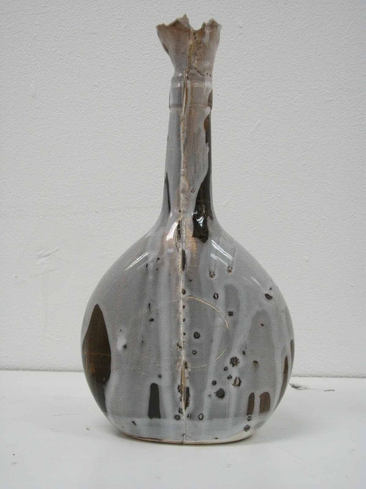 'Ruffled' mixed media: Ceramic slip cast bottles