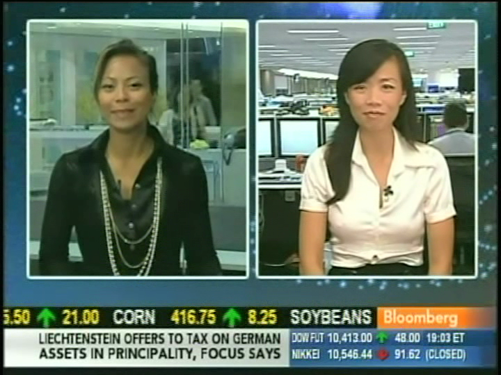 Ladies in Satin Blouses: asian Bloomberg anchor in white satin blouse