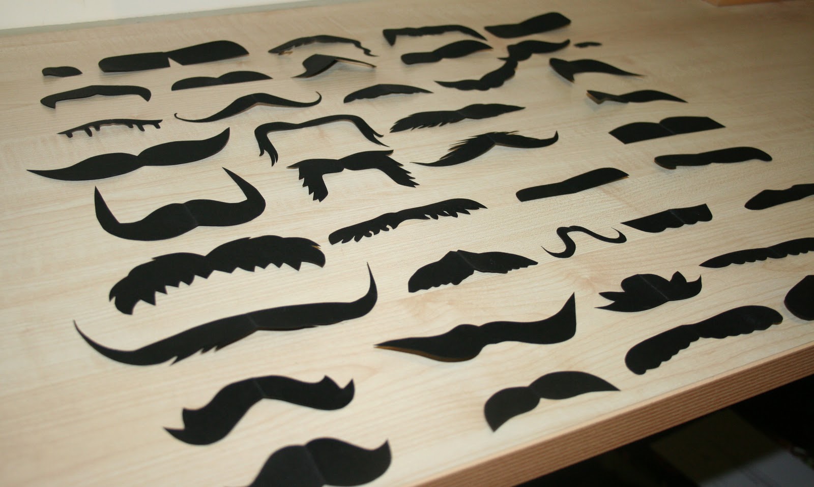 Sophie Wilson//Design Practice: 100 paper cut moustaches.