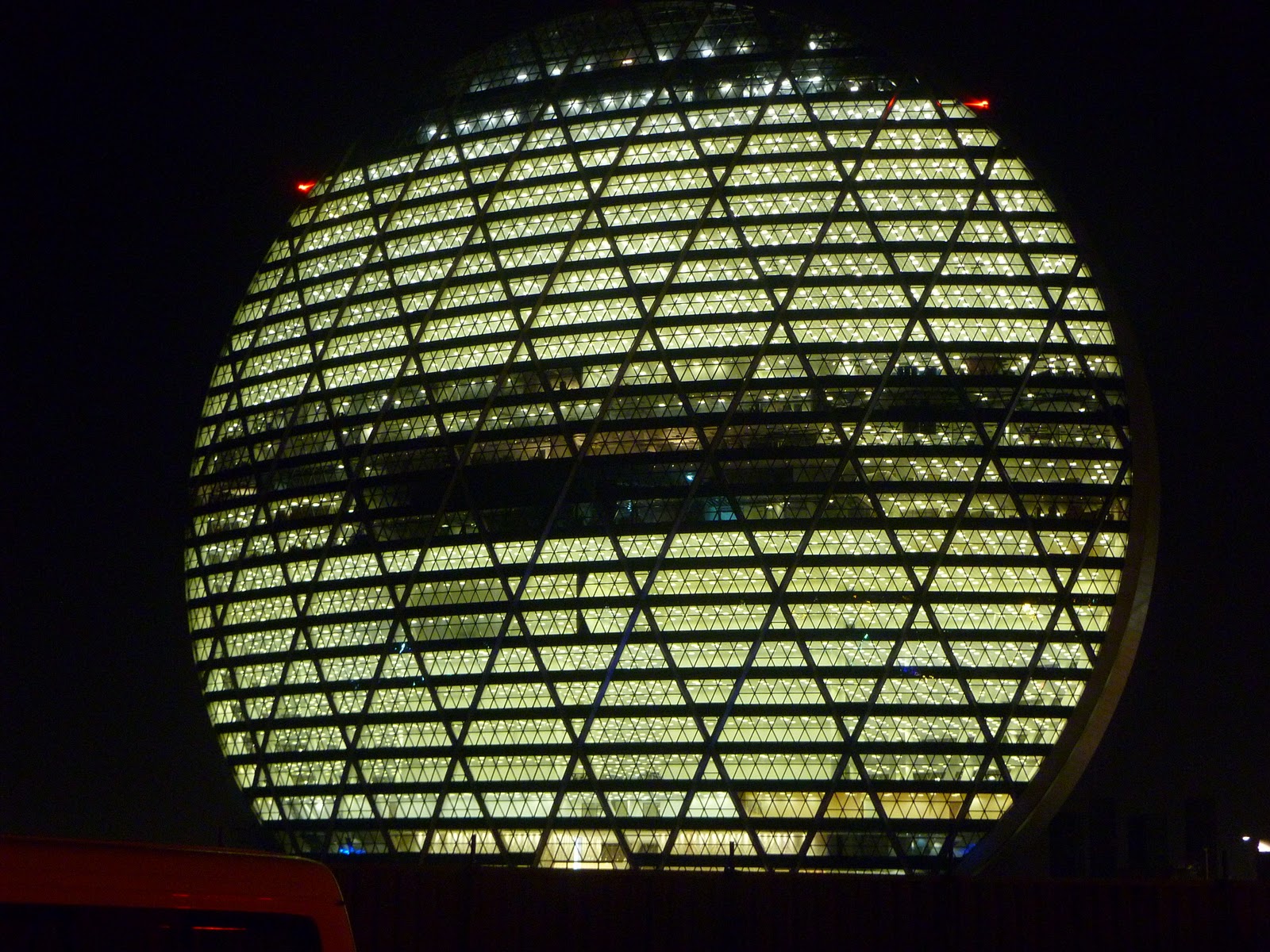 Journeys Far and Wide: Disc-Shaped Building in Al Raha, At Night