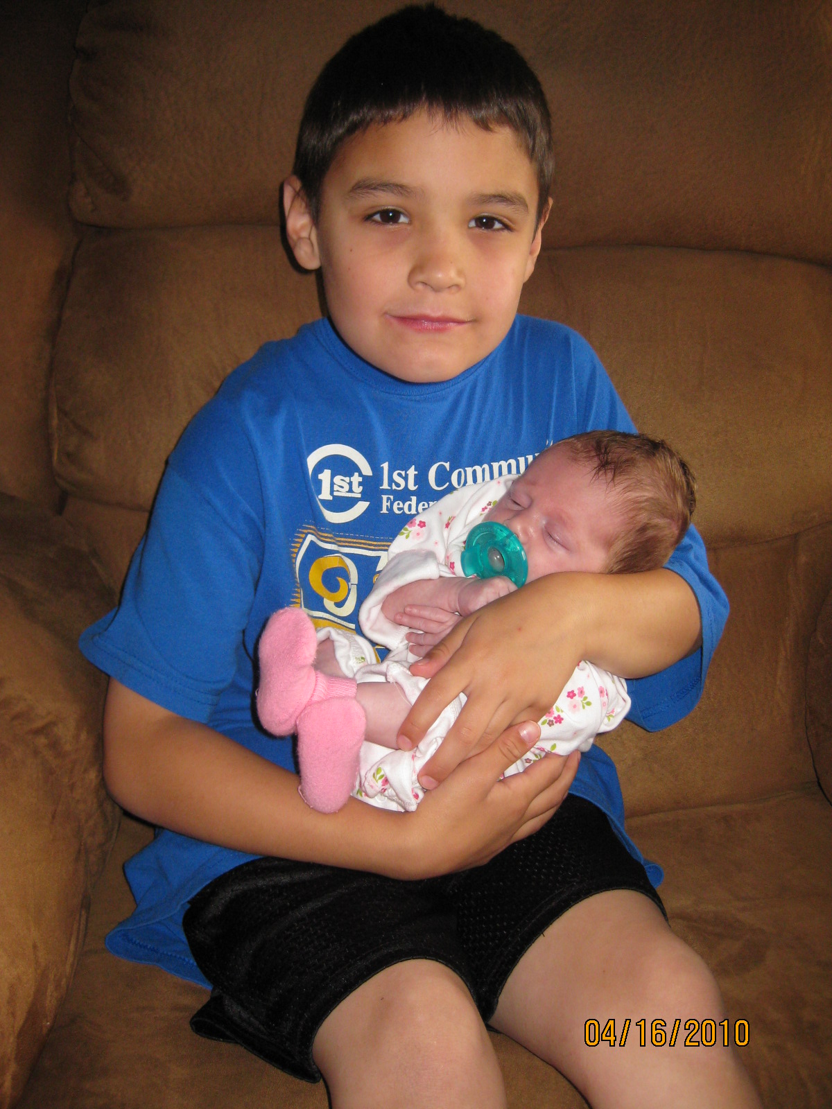 Our Family: Luke holding his baby sister