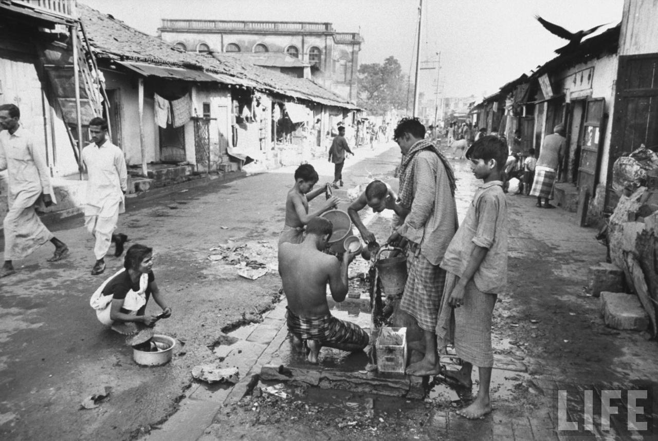 Residents of Calcutta (Kolkata) bathing in the street - December 1970 ...