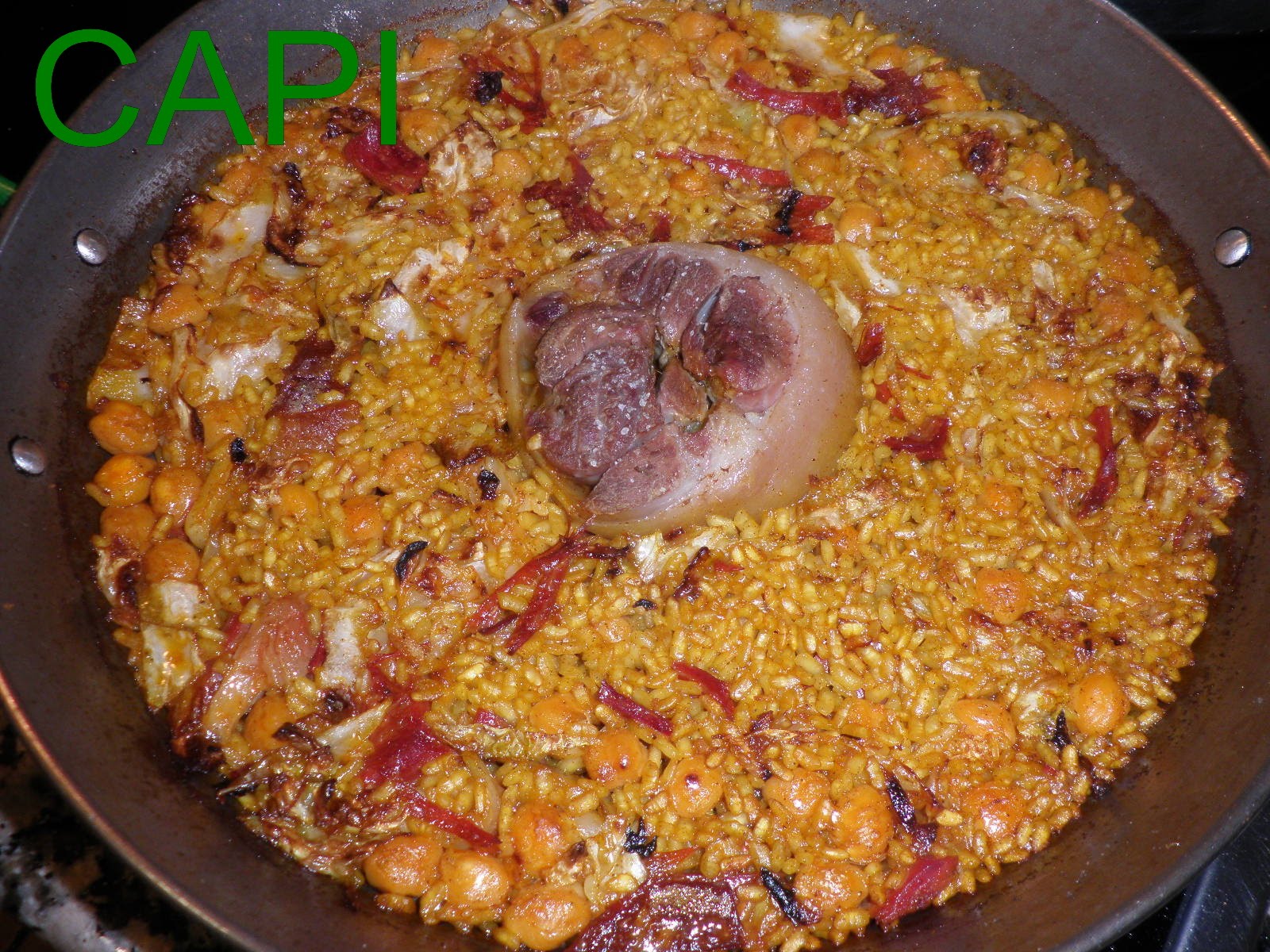 El Capitán del All i Pebre: ARROZ DE CODILLO, COL Y JAMÓN.