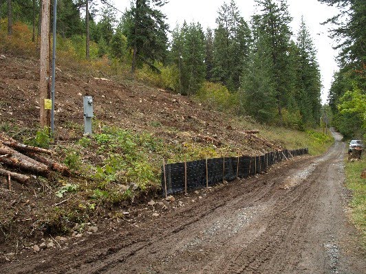 northern idaho or bust!: Driveway happens. Log picker upper is cool.